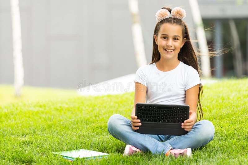 Cute Little Girl Tablet PC in the Park Stock Photo - Image of girl ...