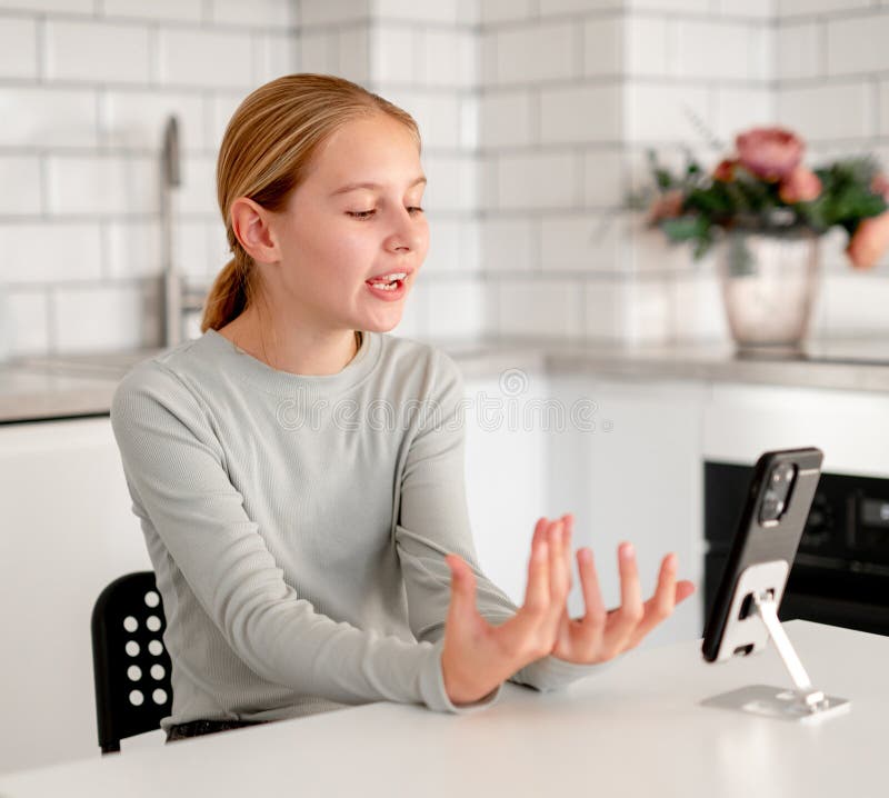 Cute Little Girl Talking Via Video Call Online Using a Smartphone Stock ...