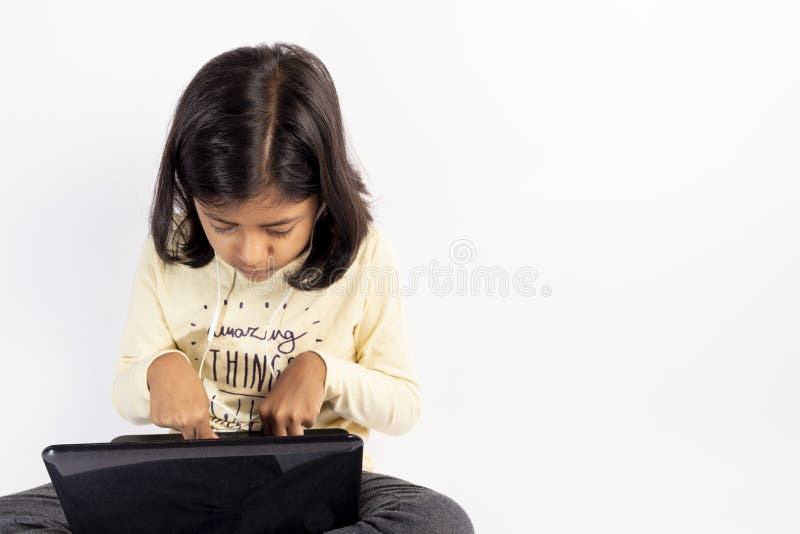 Cute Little Girl is Using Her Notebook Stock Image - Image of indoor ...