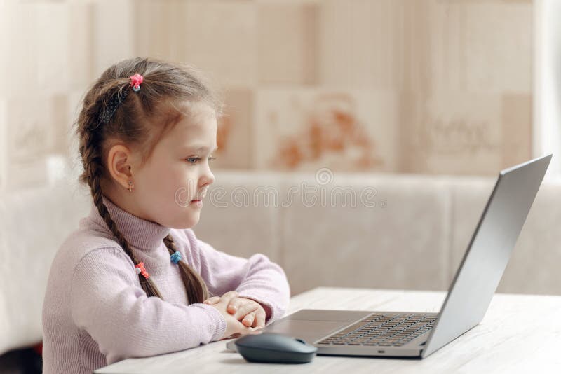 Cute Little Girl Using Laptop Computer for Online Learning Stock Photo ...