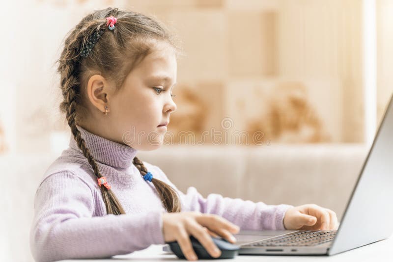 Cute Little Girl Using Laptop Computer for Online Learning Stock Photo ...