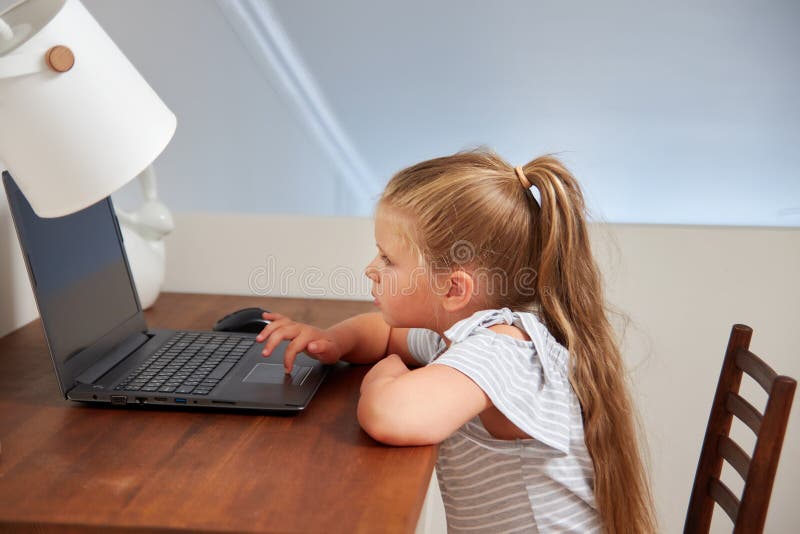 Little Girl Using Laptop at Home Stock Image - Image of pleasant ...