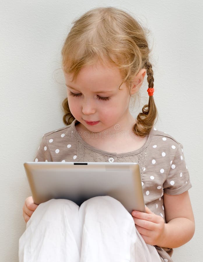 Cute Little Girl Using Tablet Computer Stock Photo - Image of innocence ...