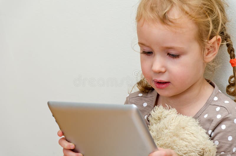 Cute Little Girl Using Tablet Computer Stock Photo - Image of ...