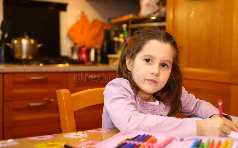 Cute Little Girl Writes on Her Notebook Stock Image - Image of person ...