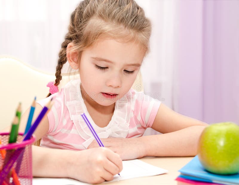 Cute Little Girl is Writing at the Desk Stock Image - Image of exercise ...