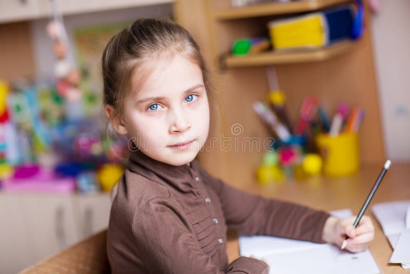 Cute Little Girl Writing Her Homework Stock Photo - Image of notebook ...