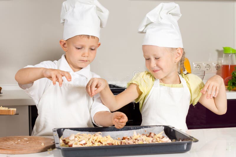 Cute Little Kid Chefs Putting Ingredients on Pizza Stock Photo - Image ...