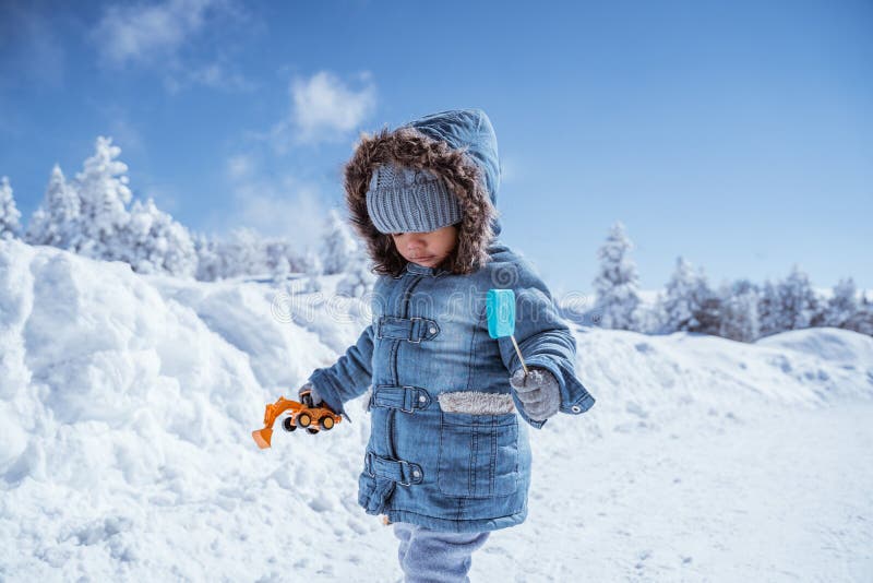 Cute Little Kid Walking Alone in Snow Stock Image - Image of cute ...