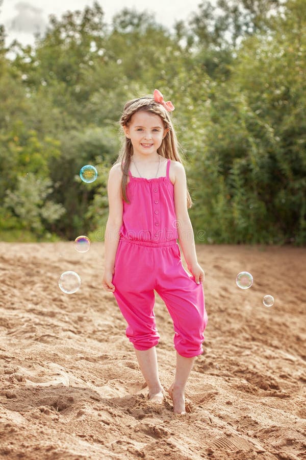 Cute Little Model Posing in Pink Overall at Beach Stock Image - Image ...