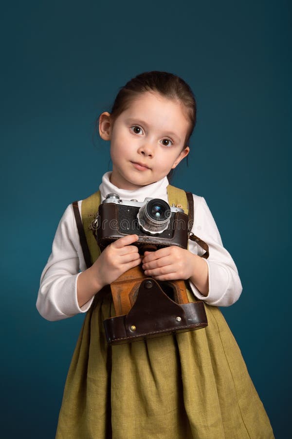 Cute Little Smiling Girl Photographer with Retro Camera. Studio ... Cute Little Smiling Girl Photographer with Retro Camera. Studio ...