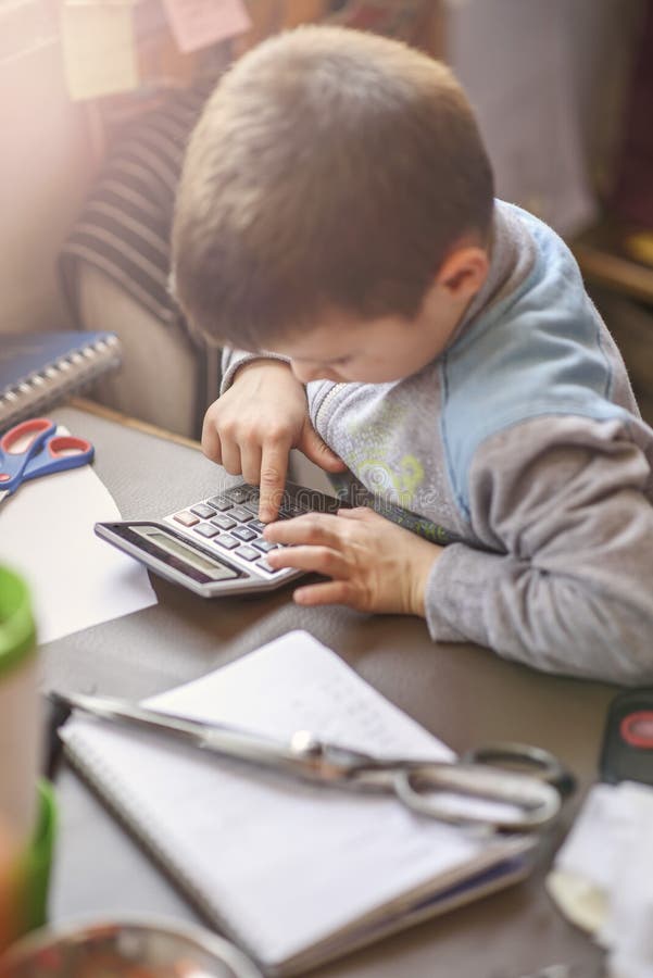 Cute Little Baby Boy Using a Calculator Stock Photo - Image of ...