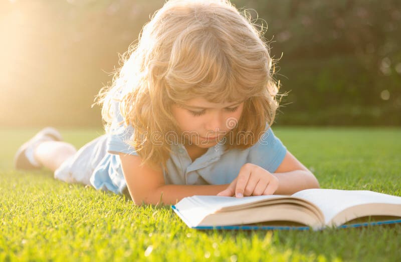 Cute Lovely Child Reading Book Outside. Kid Read Book in Park. Stock ...