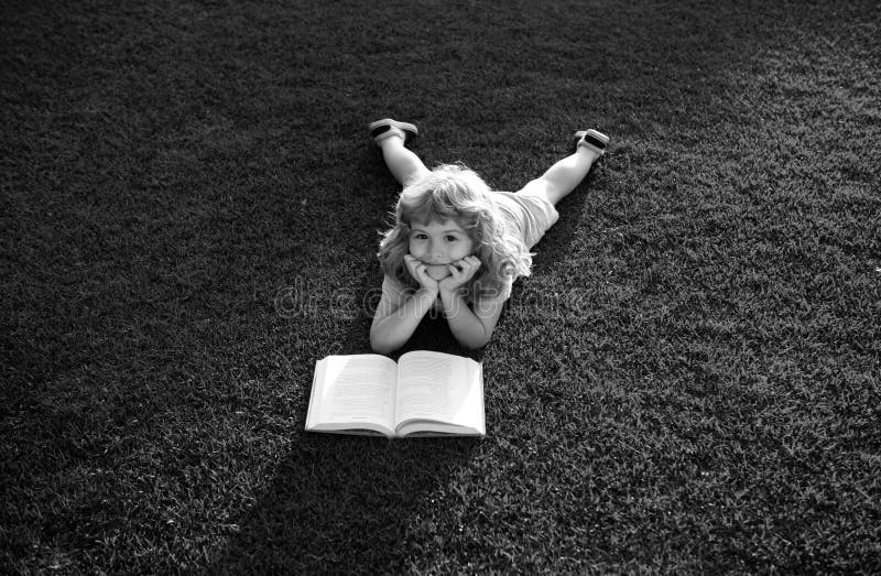 Cute Lovely Child Reading Book Outside. Kid Read Book in Park. Stock ...