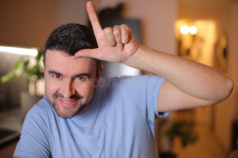 Cute Man Doing Hand Gesture To Express Defeat Stock Photo - Image of ...