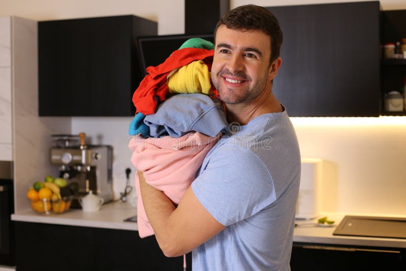 Cute man doing the laundry stock image. Image of adult - 263512965