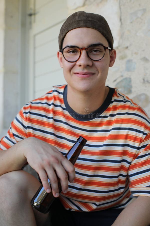 Cute man drinking a beer stock photo. Image of lager - 330980926
