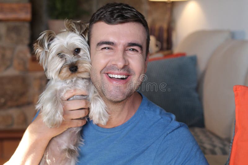 Cute Man Holding Little Dog Stock Photo - Image of education, cuddle ...