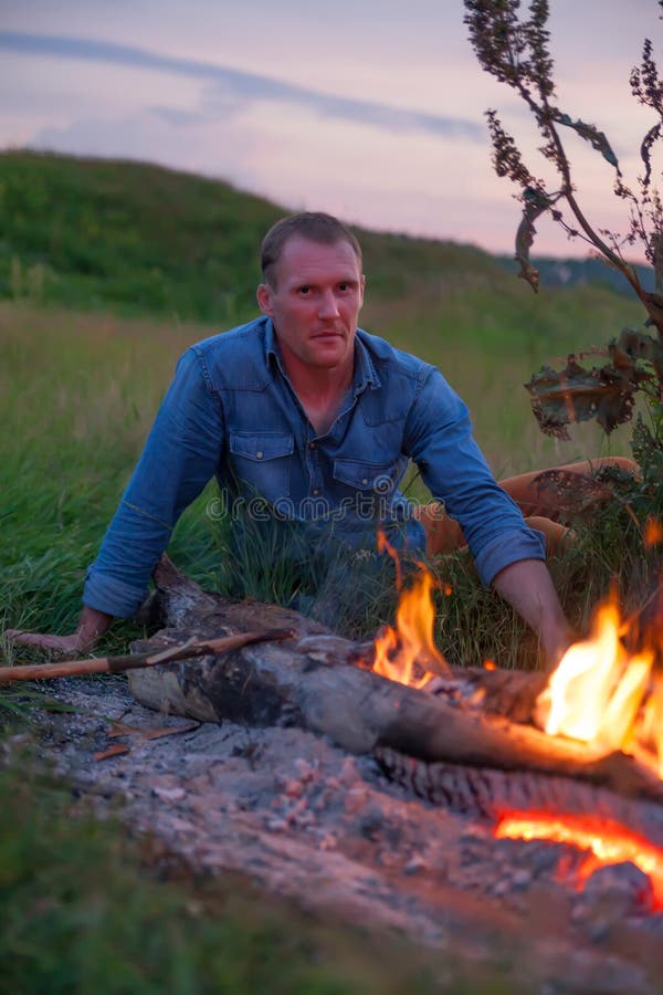 Cute Man Sitting Near Bonfire Stock Photos - Free & Royalty-Free Stock ...