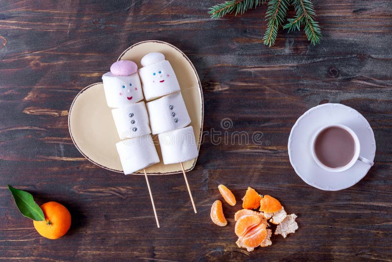 Marshmallow Snowmen on the Heart Shaped Plate Stock Photo - Image of ...