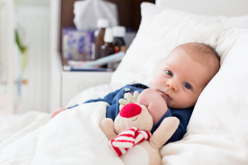 Cute Newborn Baby Boy, Lying in Bed with Cold Stock Image - Image of ...