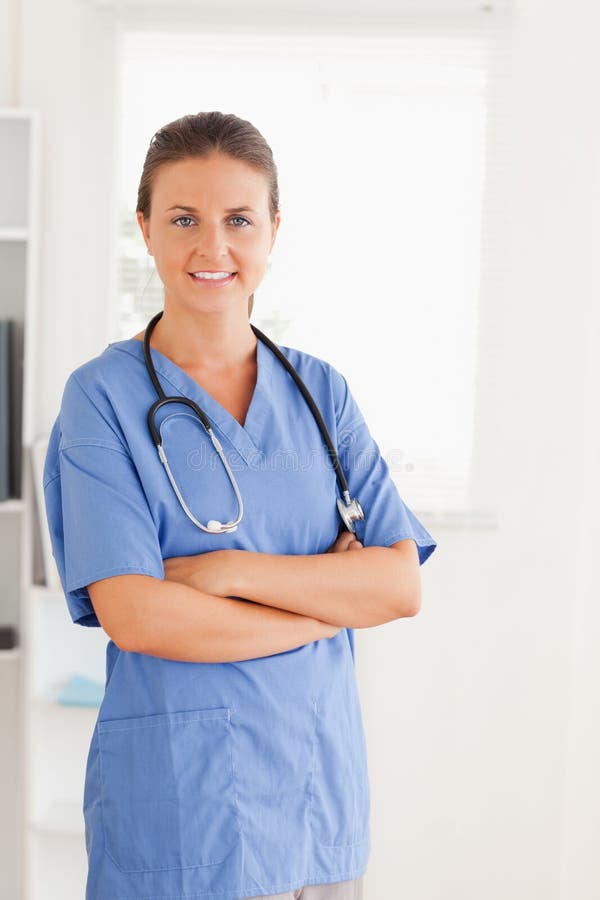 Portrait of Female Nurse Working at Nurses Station Stock Photo - Image ...