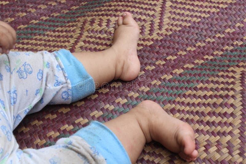 Cute pair of child s foot stock image. Image of garden - 70033295