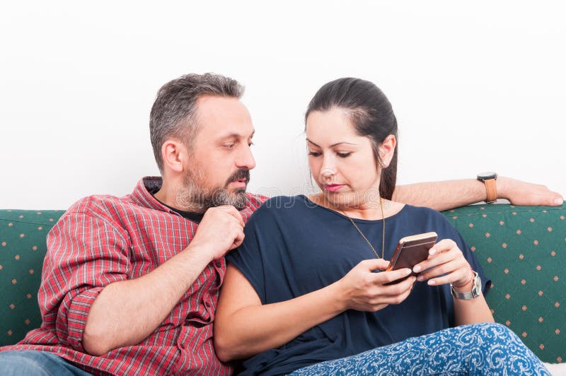 Cute Pair Relaxing on Sofa at Home Stock Photo - Image of modern ...