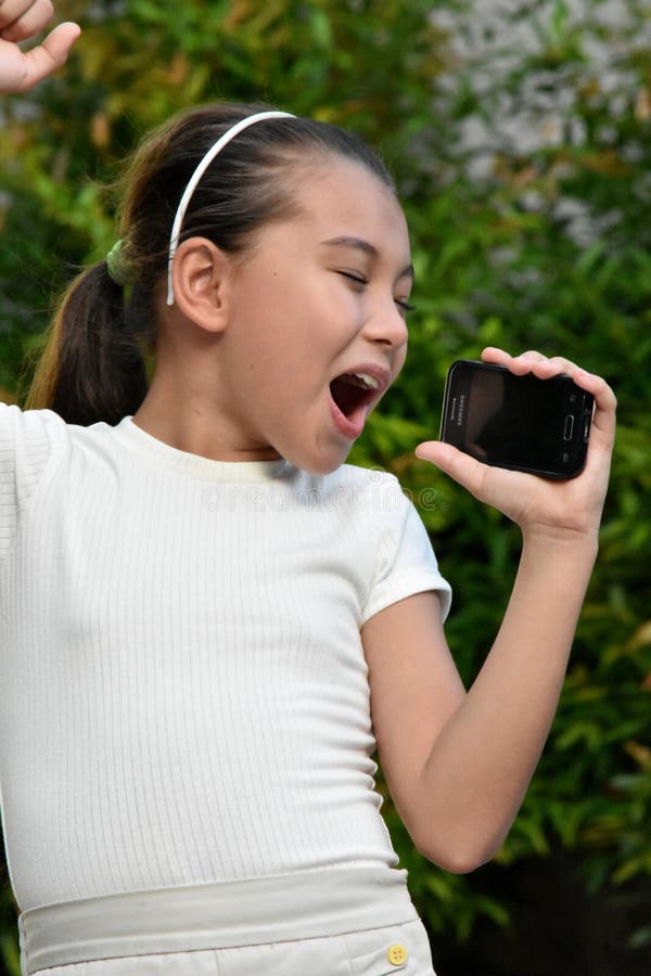 Cute Philippina Female Singing Using Mobile Phone Stock Image - Image ...