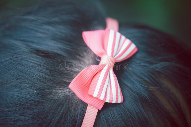 Cute Pink Bow with Striped Pattern on a Head of Girl Stock Image ...