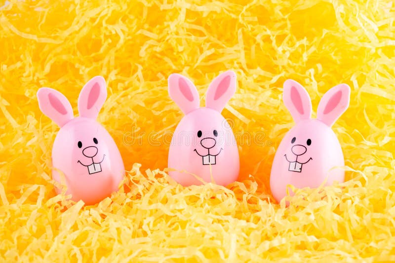 Cute Pink Easter Egg Bunny Surrounded with Bright Yellow Paper Strands ...
