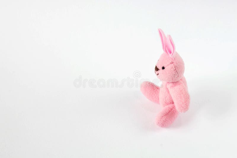 A Cute Pink Rabbit is Sitting on White Background. Stock Photo - Image ...