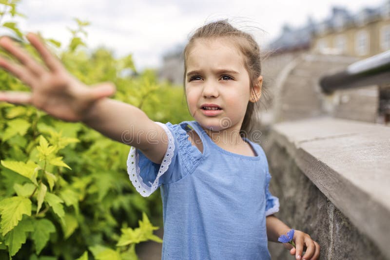 Cute Portrait of a Nice Little Girl Outside Hand on Front Stock Photo ...