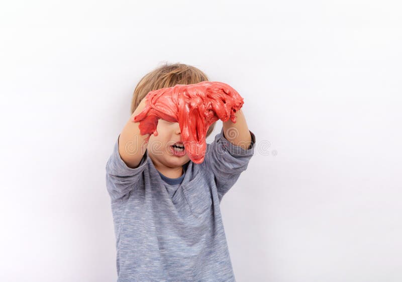 Cute Preschooler Boy Playing with Red Slime Stock Photo - Image of blue ...