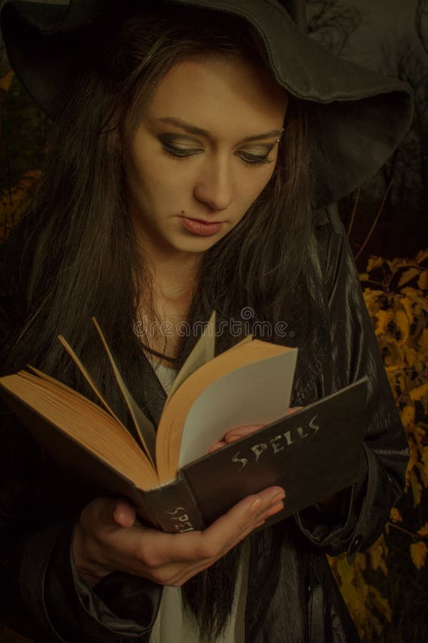Witch with spellbook stock photo. Image of melancholy - 229126216