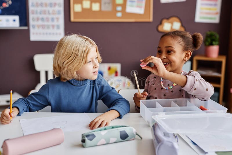 Cute Primary School Learner Using Pencil Sharpener at Lesson Stock ...