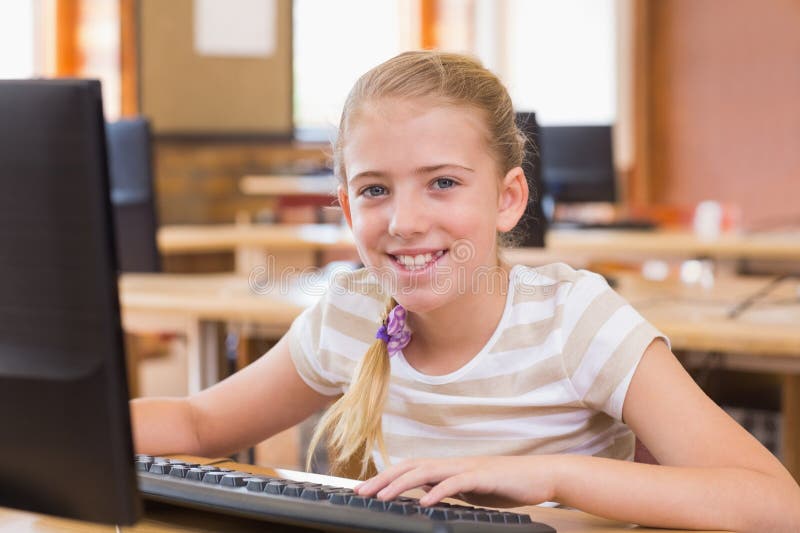Female Child Student Typing on Keyboard and Smiling at Monitor in ...