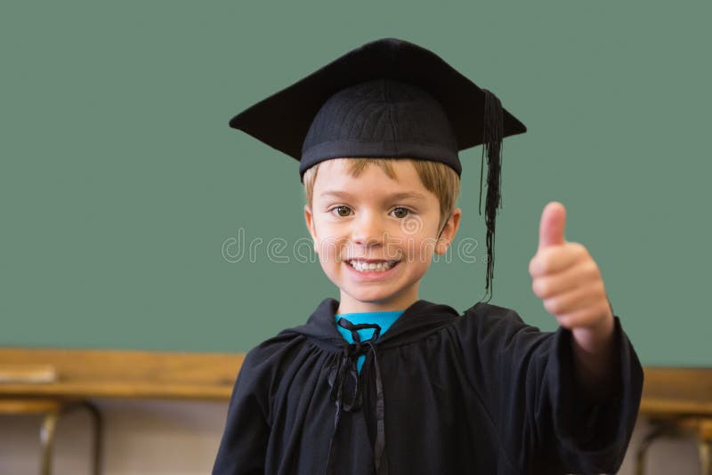 Cute Pupil in Graduation Robe Smiling at Camera in Classroom Stock ...