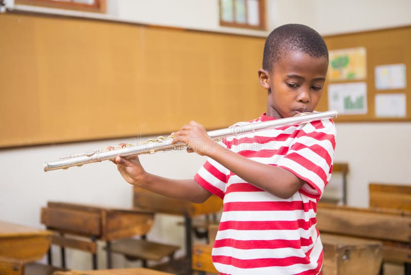 Cute Pupil Playing Flute in Classroom Stock Image - Image of classroom ...