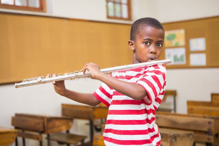 Cute Pupil Playing Flute in Classroom Stock Image - Image of serious ...