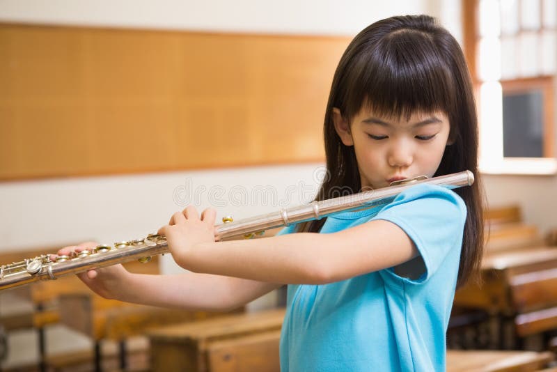 Cute Pupil Playing Flute in Classroom Stock Photo - Image of musical ...