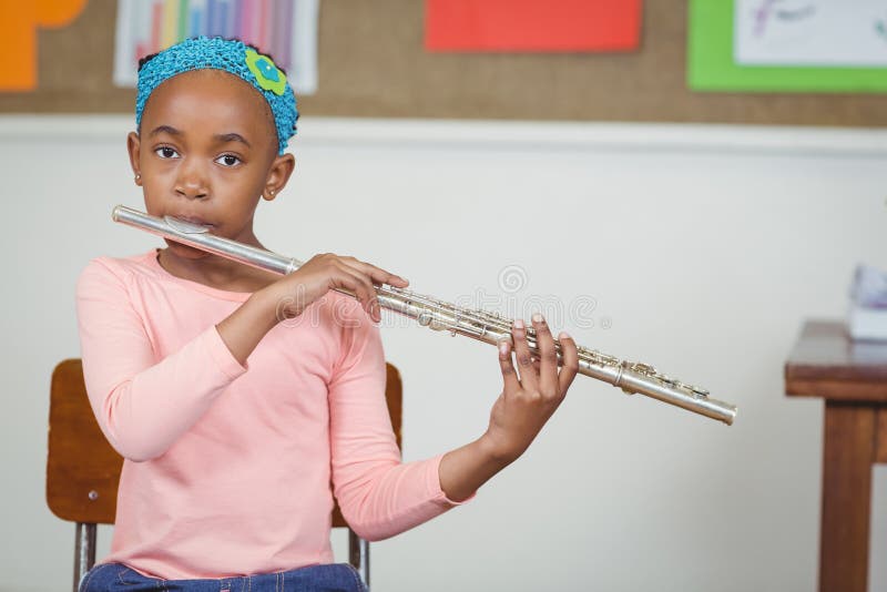 Cute Pupil Playing Flute in a Classroom Stock Image - Image of lesson ...