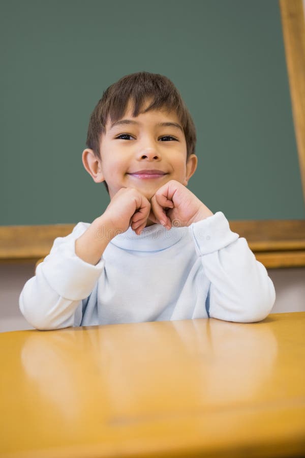 Cute Pupil Sitting at Desk in Classroom Stock Image - Image of ...
