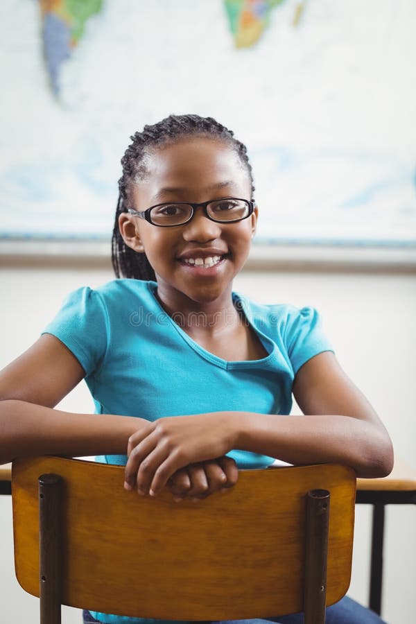 Cute Pupil Sitting at Her Desk in a Classroom Stock Photo - Image of ...