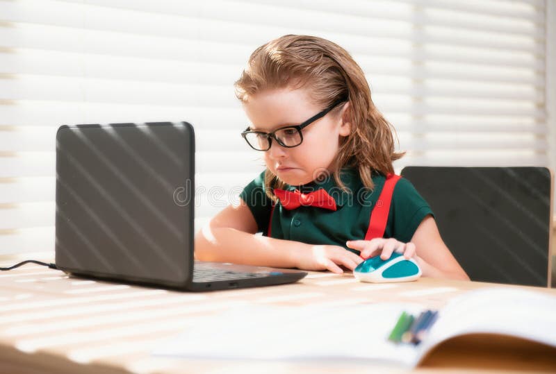 Kid Boy Writing in Classroom. Child of Primary School. Stock Photo ...