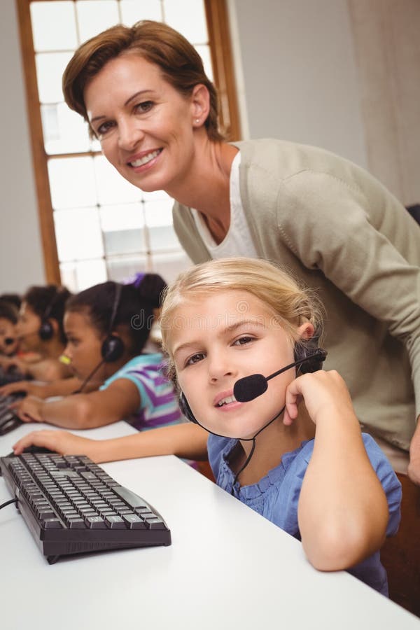 Cute Pupils in Computer Class with Teacher Stock Image - Image of ...