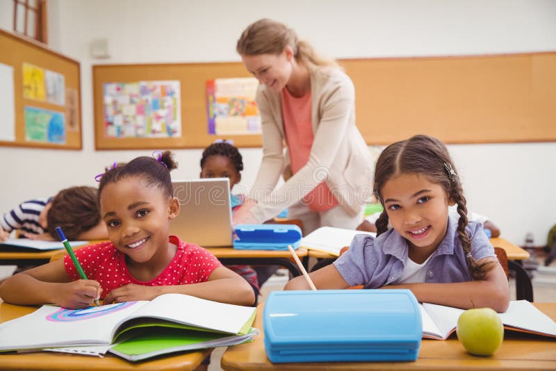Cute Pupils Drawing at Desk in Classroom Stock Image - Image of male ...