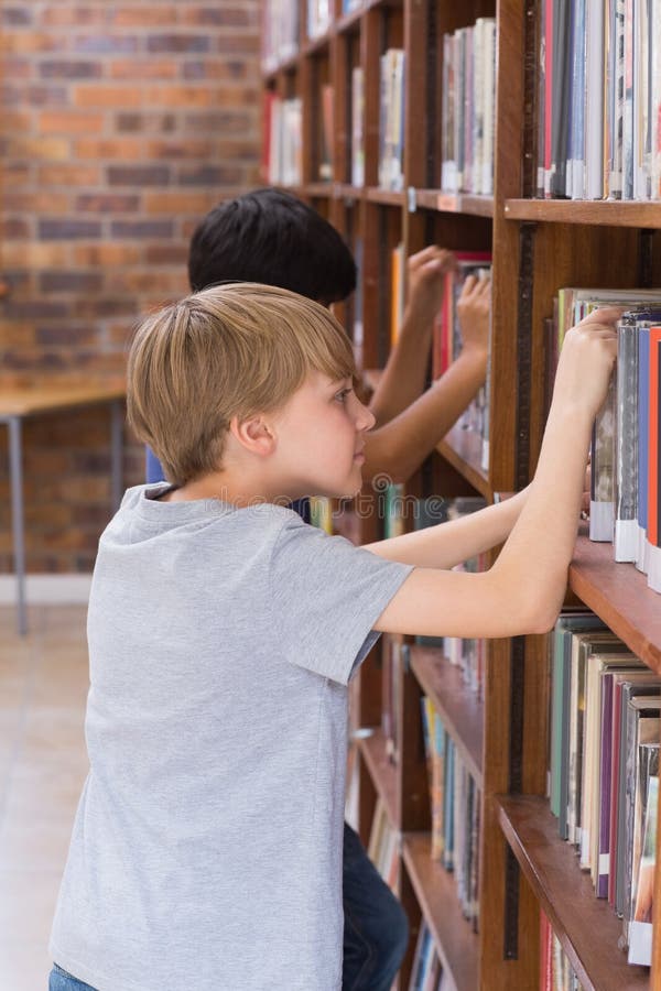 Cute Pupils Looking for Books in Library Stock Image - Image of book ...