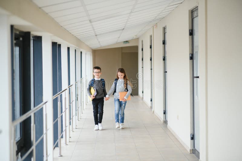 Cute Pupils Running Down the Hall at the Elementary School Stock Photo ...