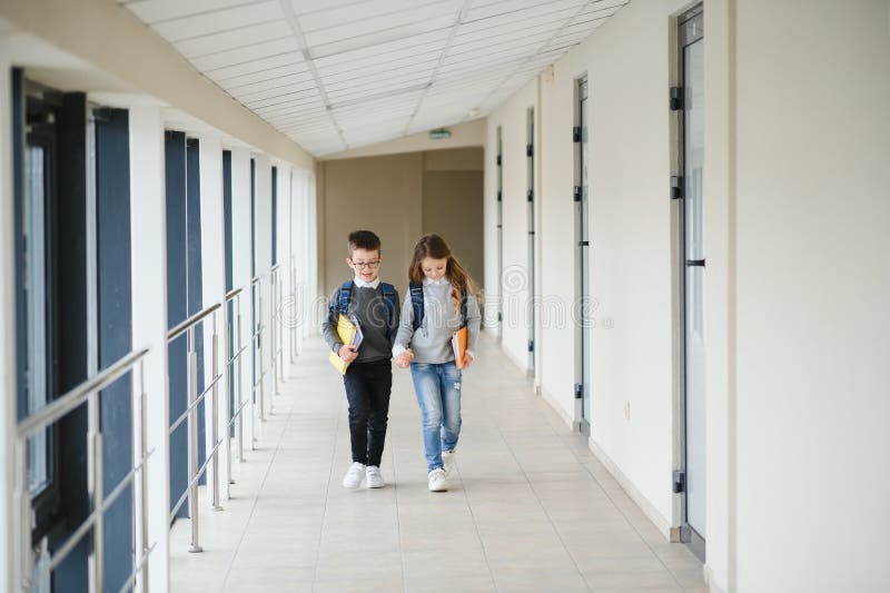Cute Pupils Running Down the Hall at the Elementary School Stock Photo ...